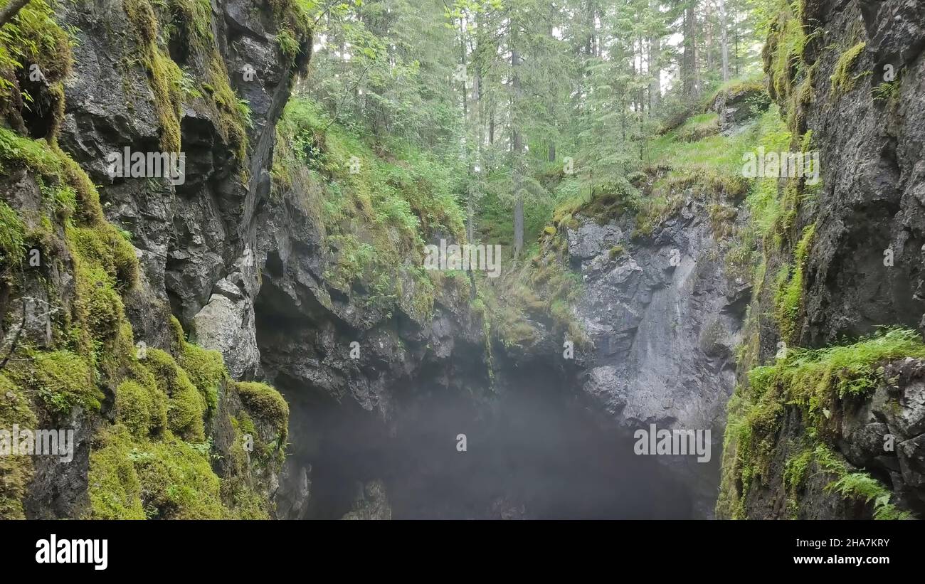 Top view of gorge between rocks in forest. Stock footage. Two cliffs ...
