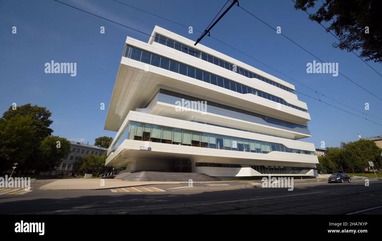 Beautiful white facade of futuristic office building. Action. Facade of ...