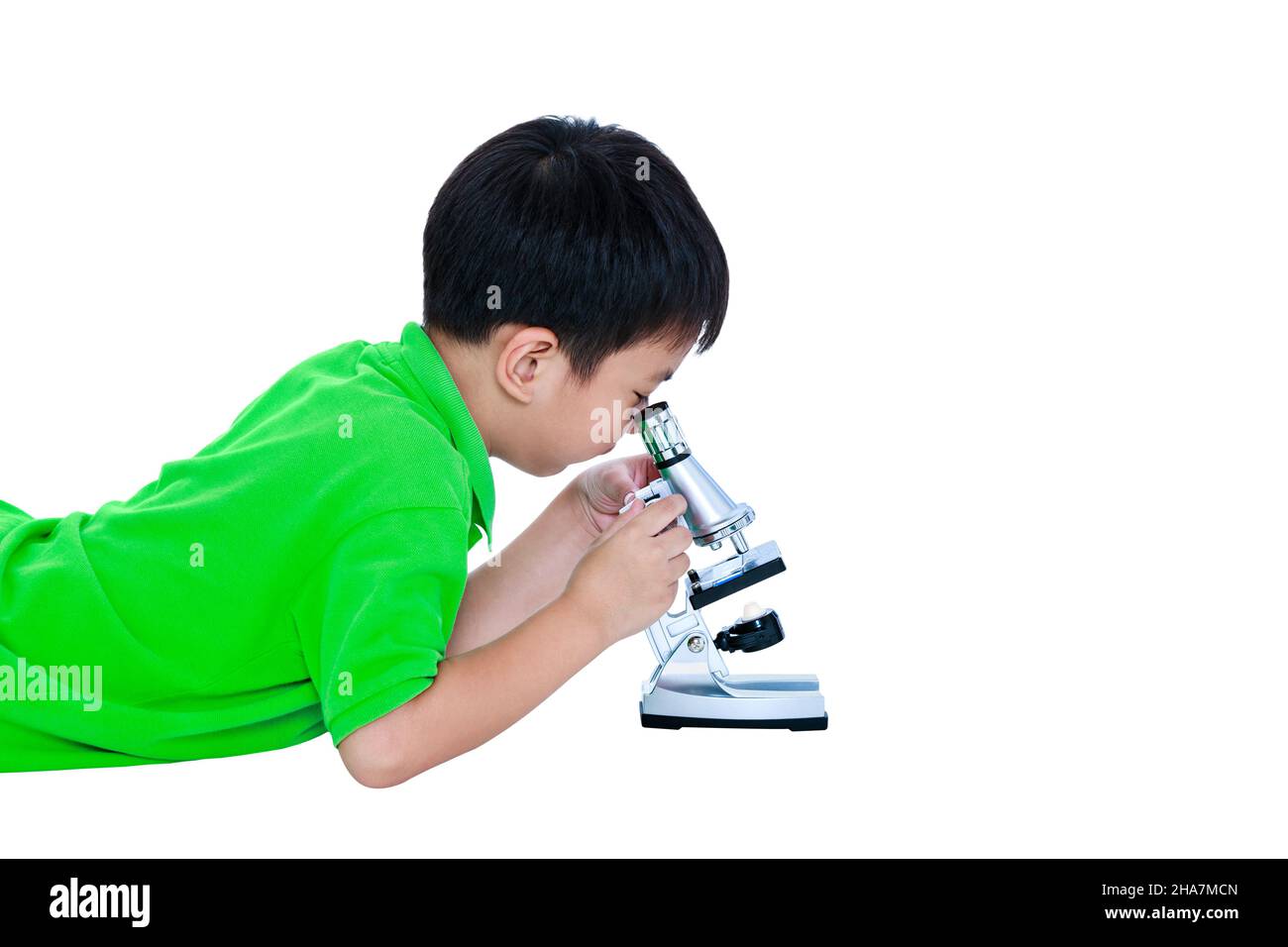 Asian child observed through a microscope biological preparations with ...