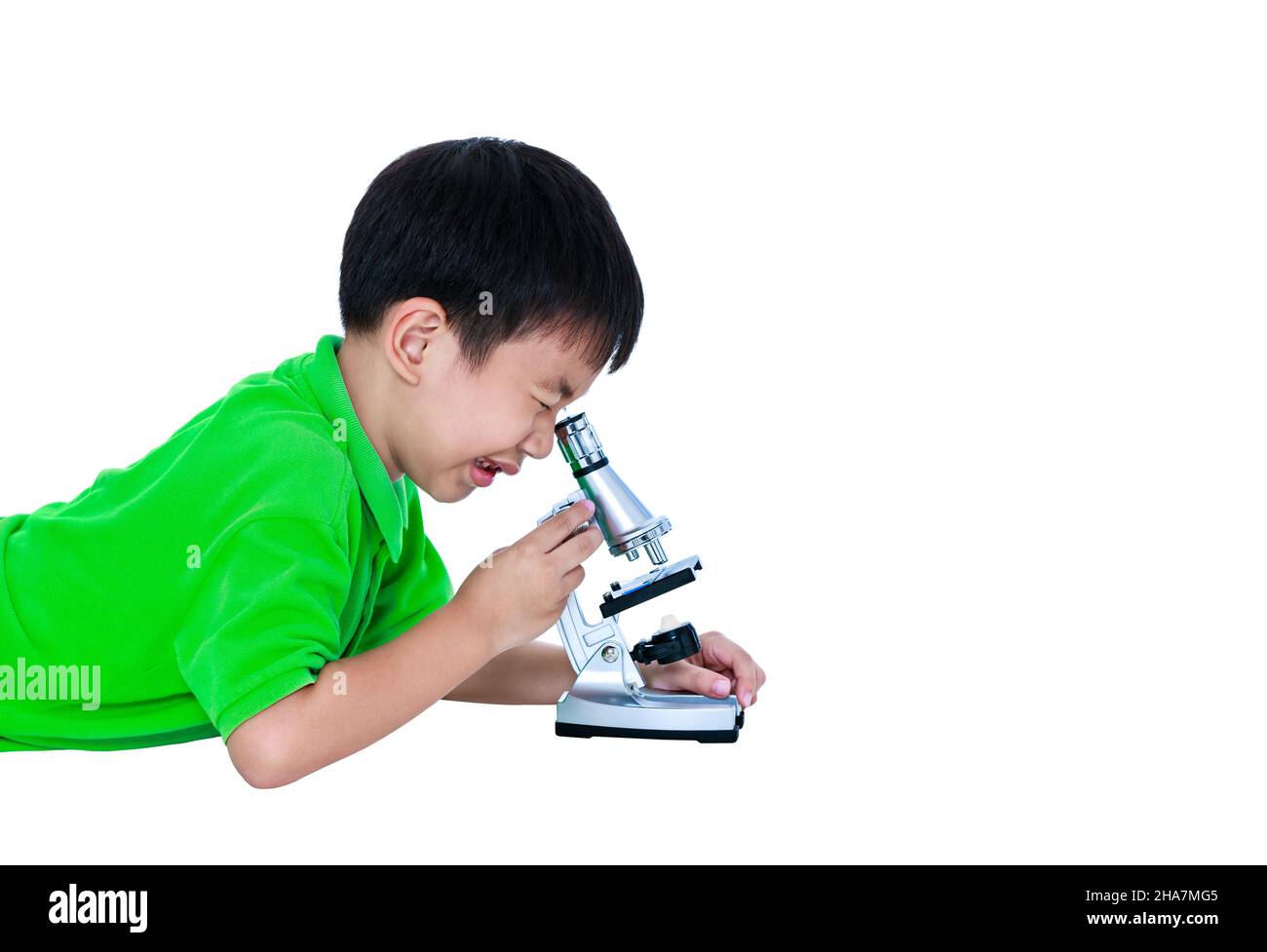 Asian child observed through a microscope biological preparations with ...