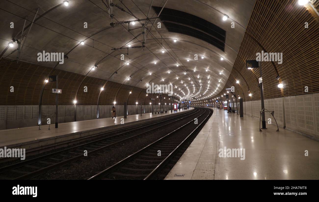 Underground subway tunnel with bright lighting. Action. Simple stone ...