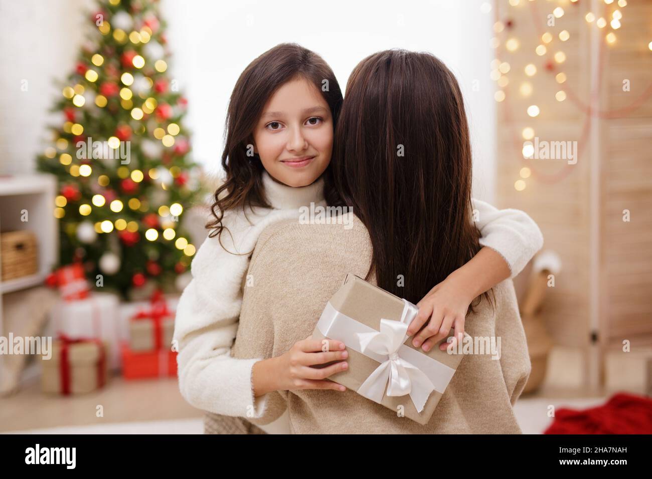 Christmas tradition - portrait of cute preteen girl with Christmas gift ...