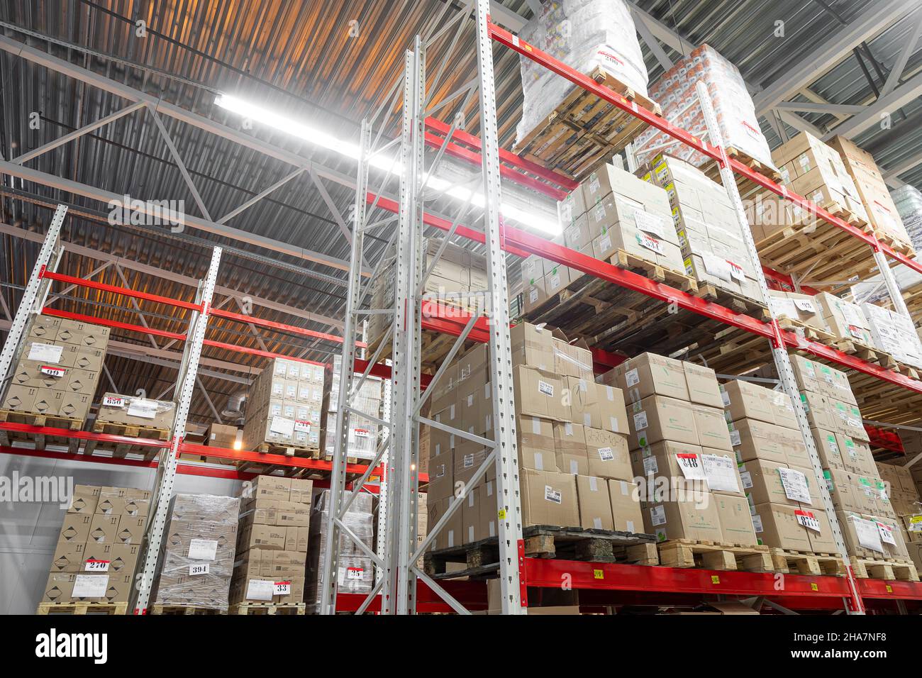 logistics center with huge red high racks Stock Photo - Alamy