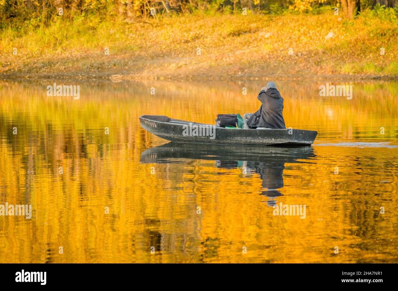 Begec, Serbia - October 30. 2021: Sport fisherman in a boat on an ...