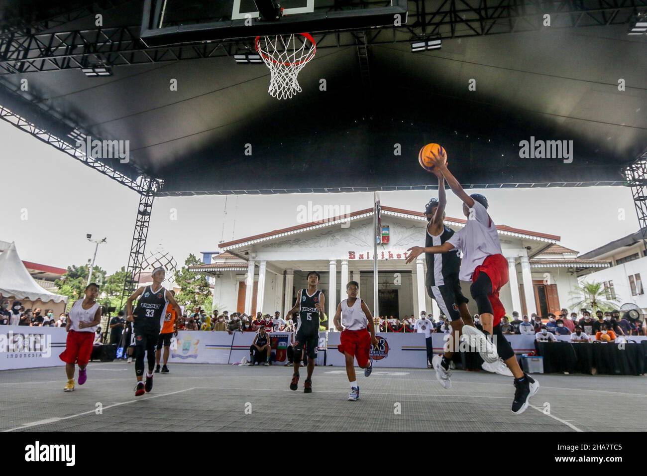 Men play 3x3 basketball during a competition 3x3 basketball at city ...