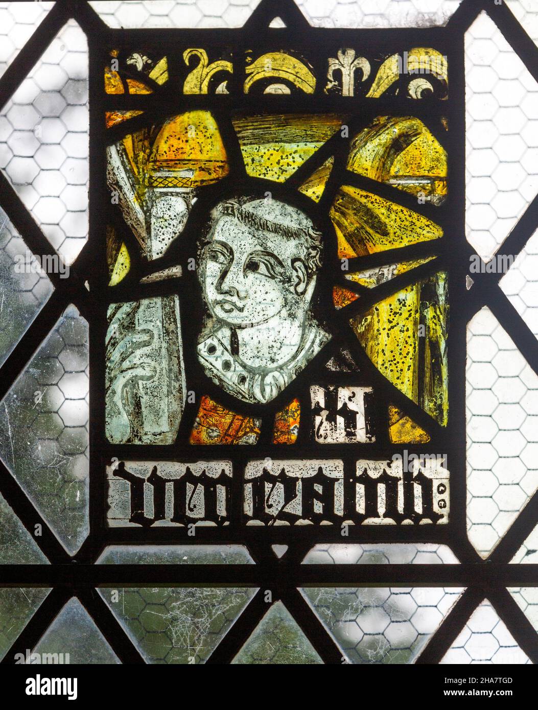 Fifteenth century stained glass window depicting the head of a monk ...