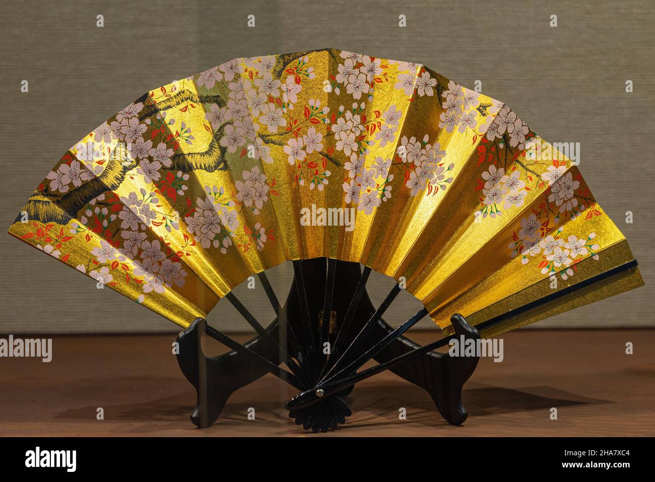 Chinese traditional foldable fan on a black holder Stock Photo - Alamy