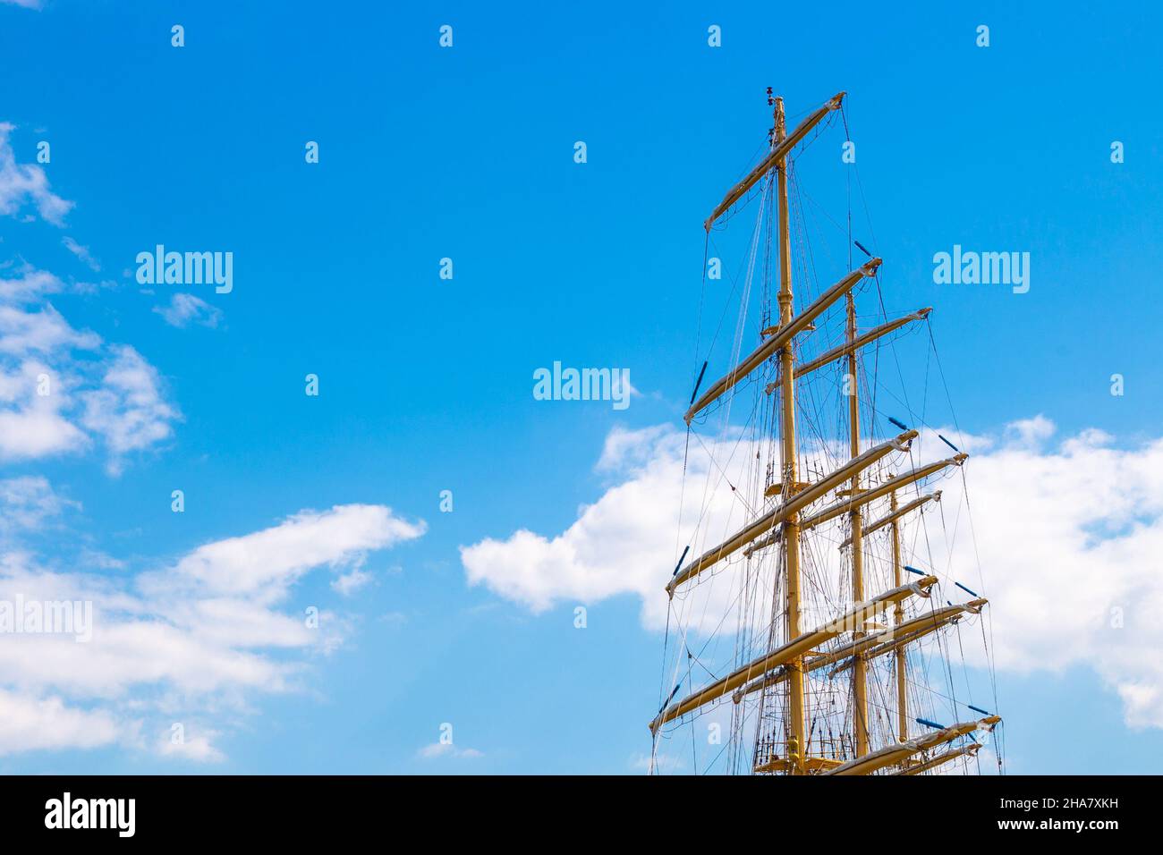 wooden mast of a military sailing ship against a blue sky Stock Photo ...