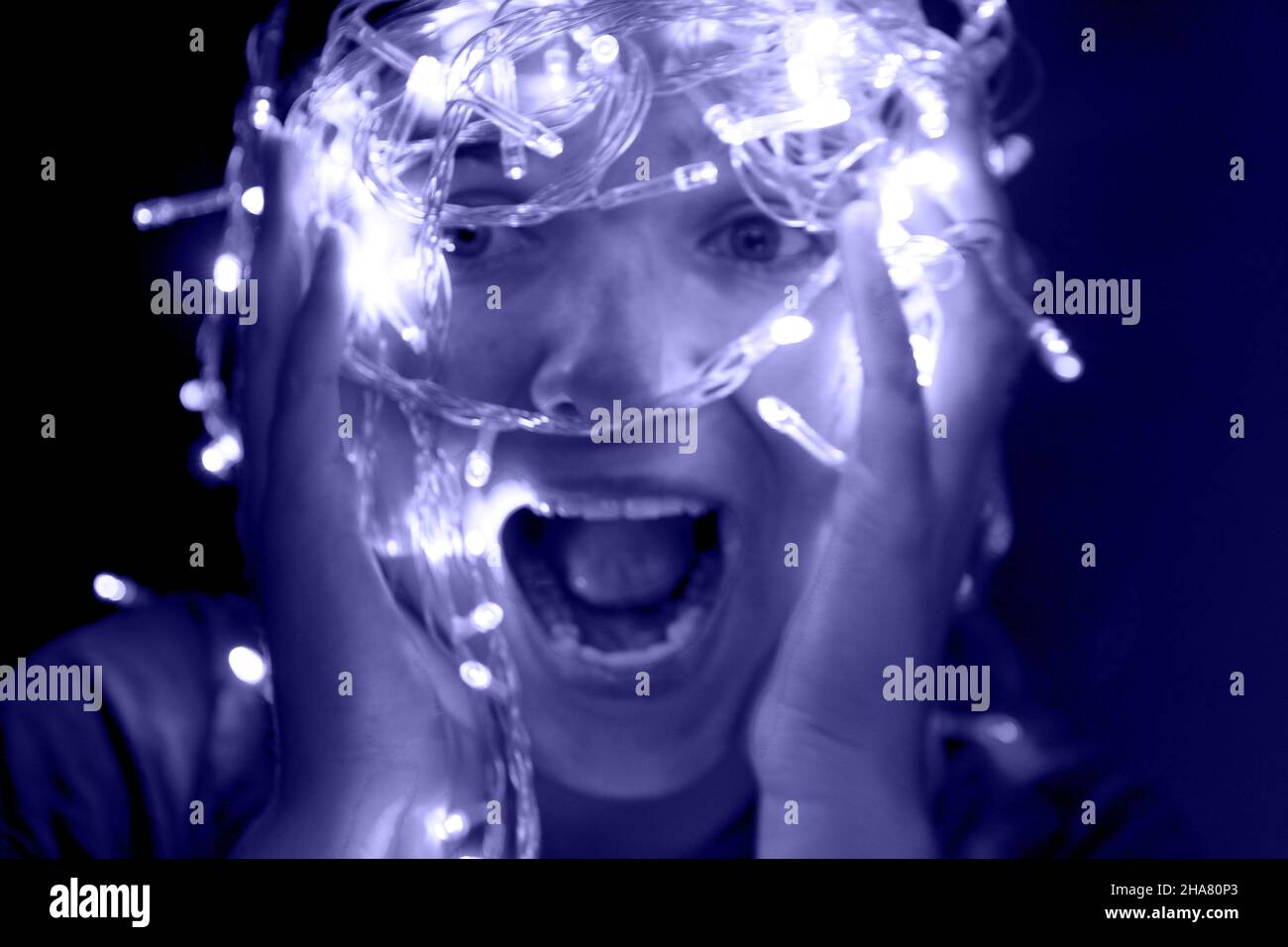 Woman is clutching her head in a panic. Stressed Christmas Girl ...