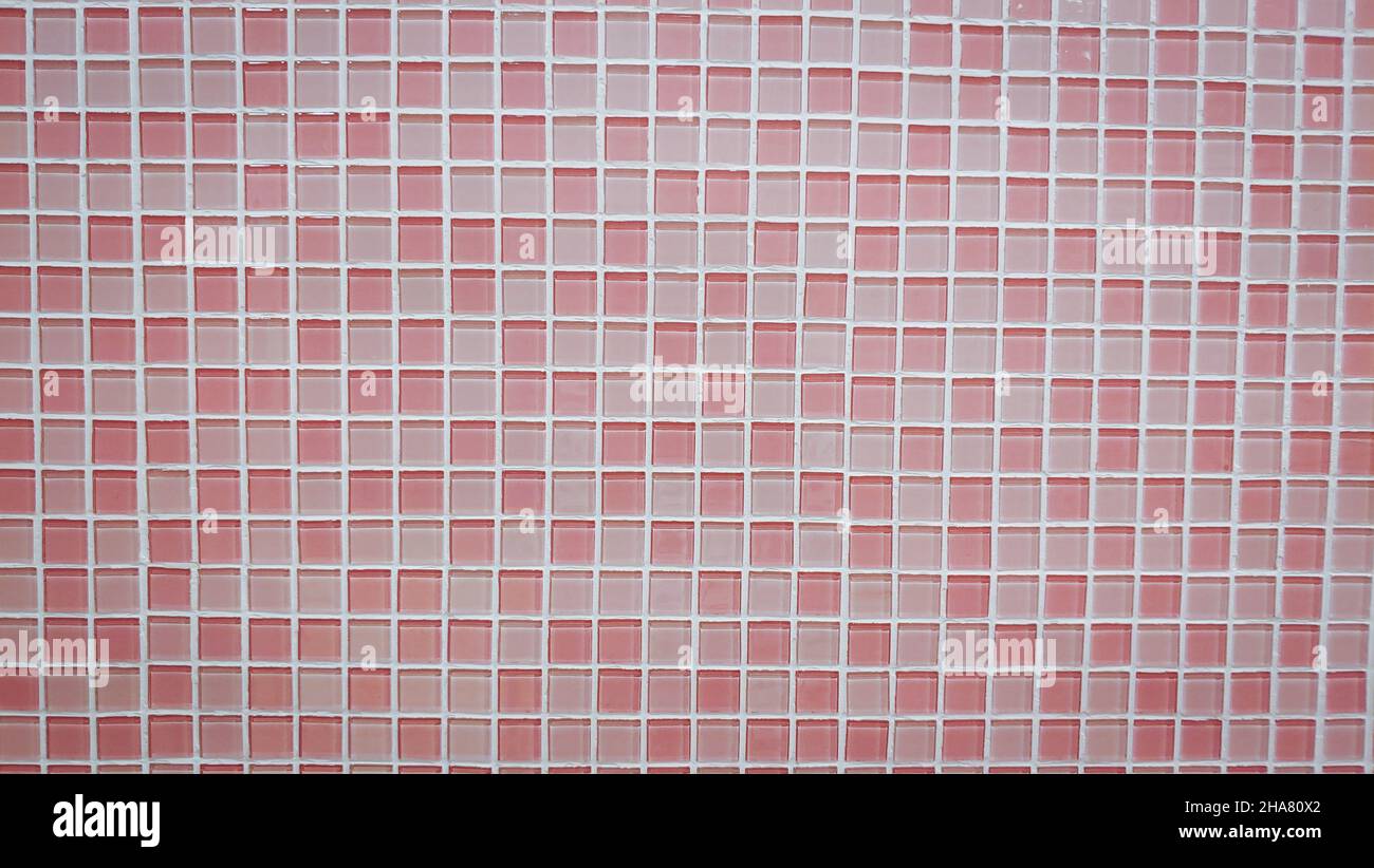 pink mosaic tiles symmetrical bathroom tiles pattern Stock Photo - Alamy