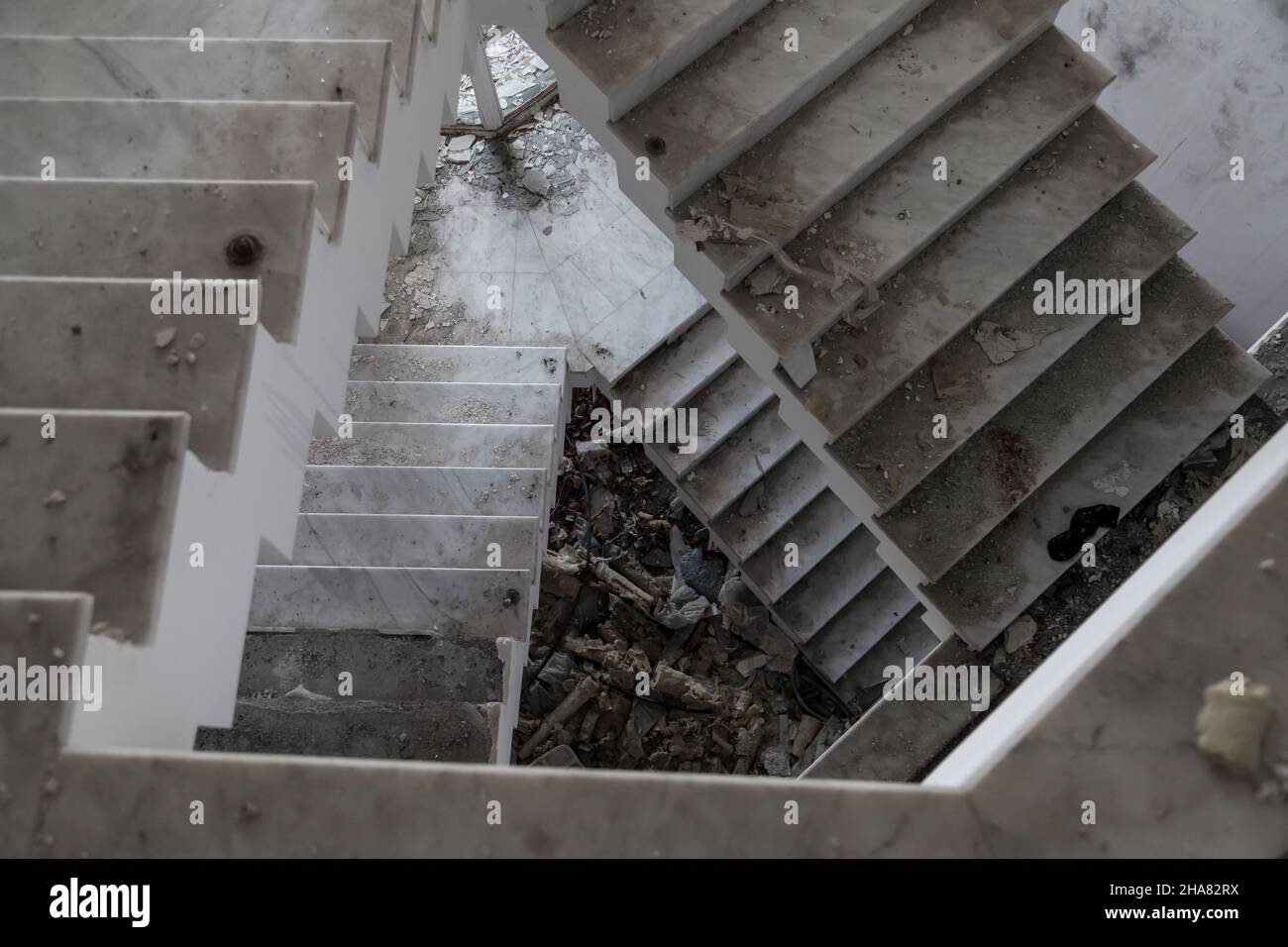 An old staircase in an abandoned house with an interior destroyed by ...