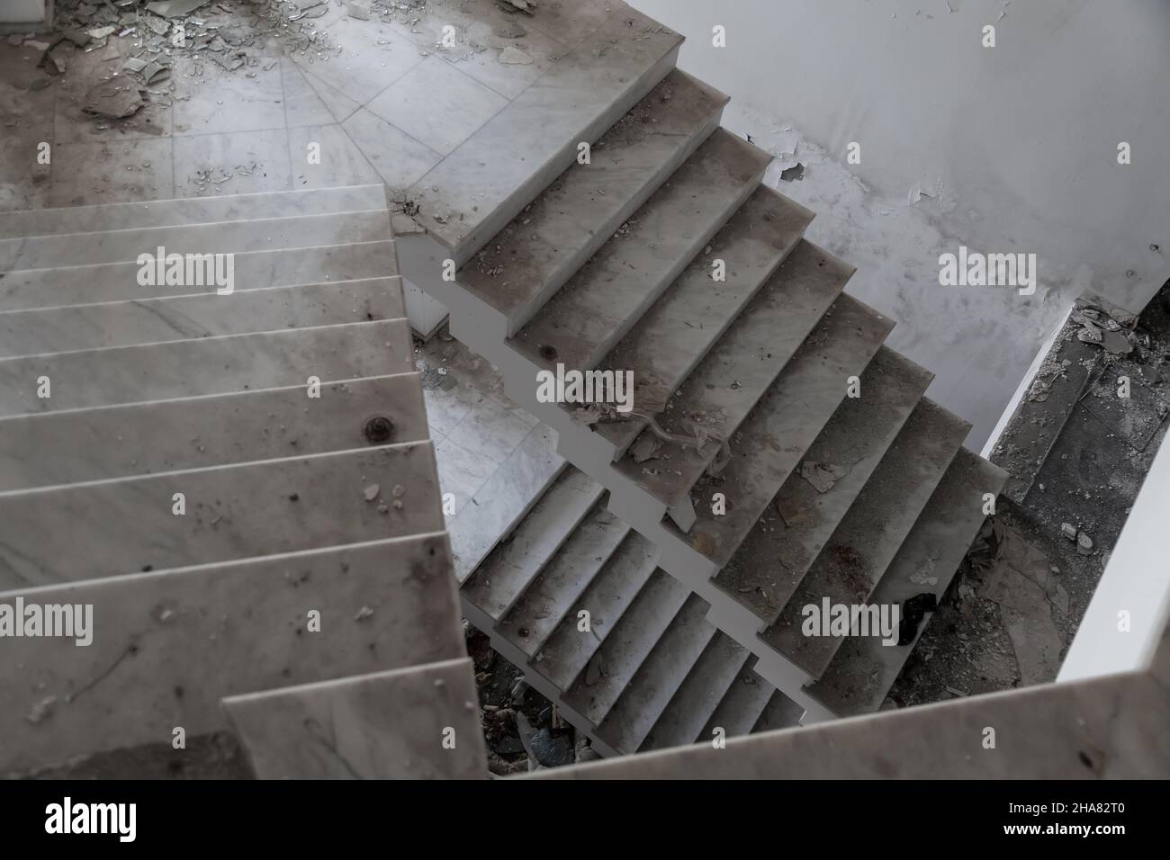 An old staircase in an abandoned house with an interior destroyed by ...