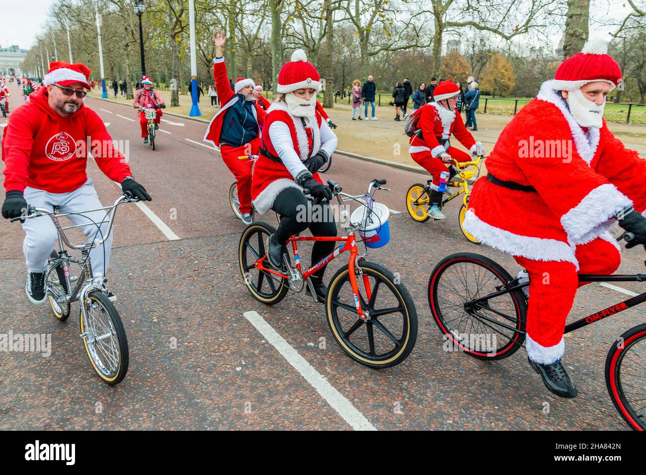 London, UK. 11th Dec, 2021. Riding down the Mall in Sant suits - The ...