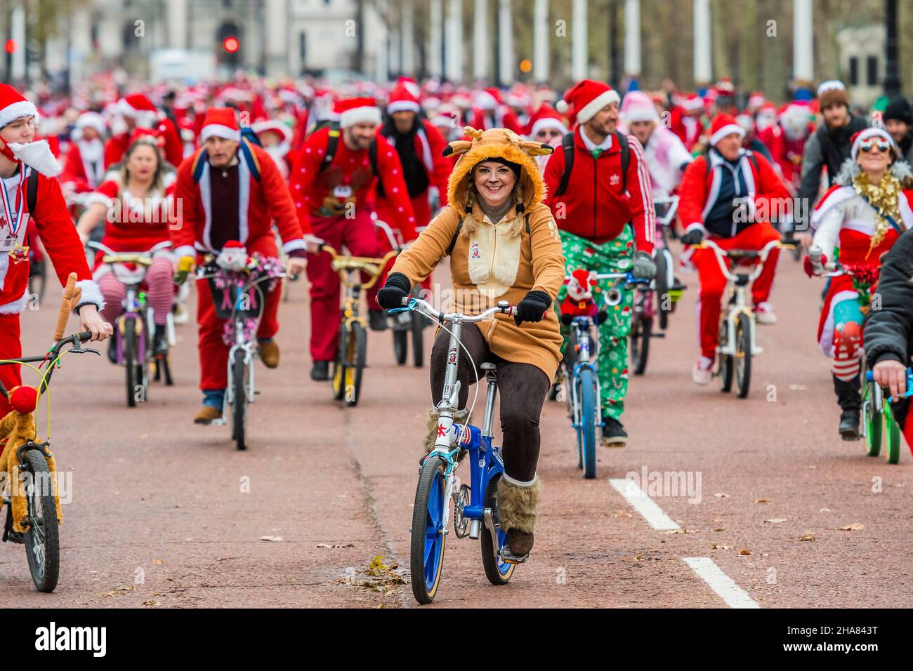 London, UK. 11th Dec, 2021. Riding down the Mall in Sant suits - The ...