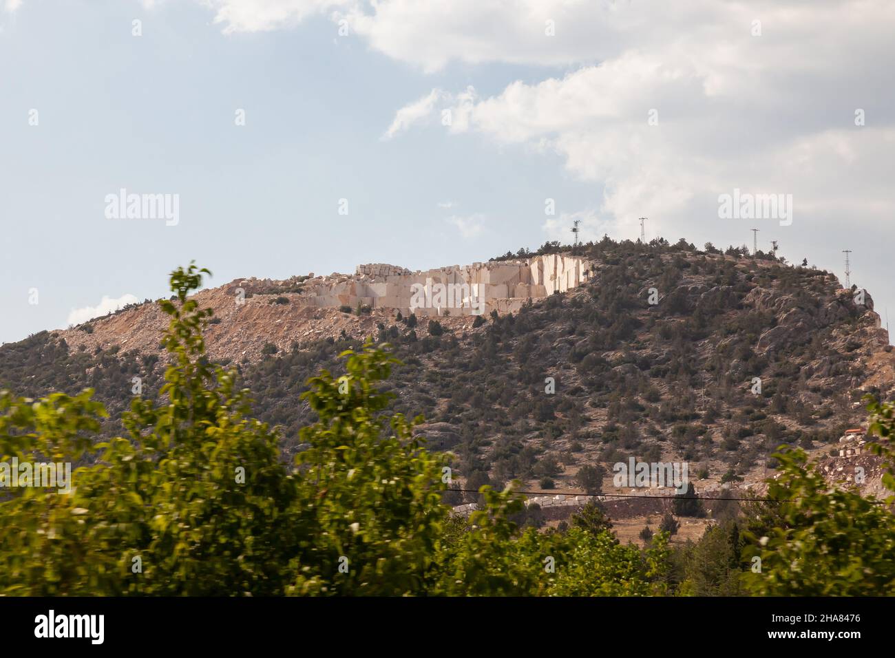 High stone mountain and marble quarries in Turkey. Open marble mining ...
