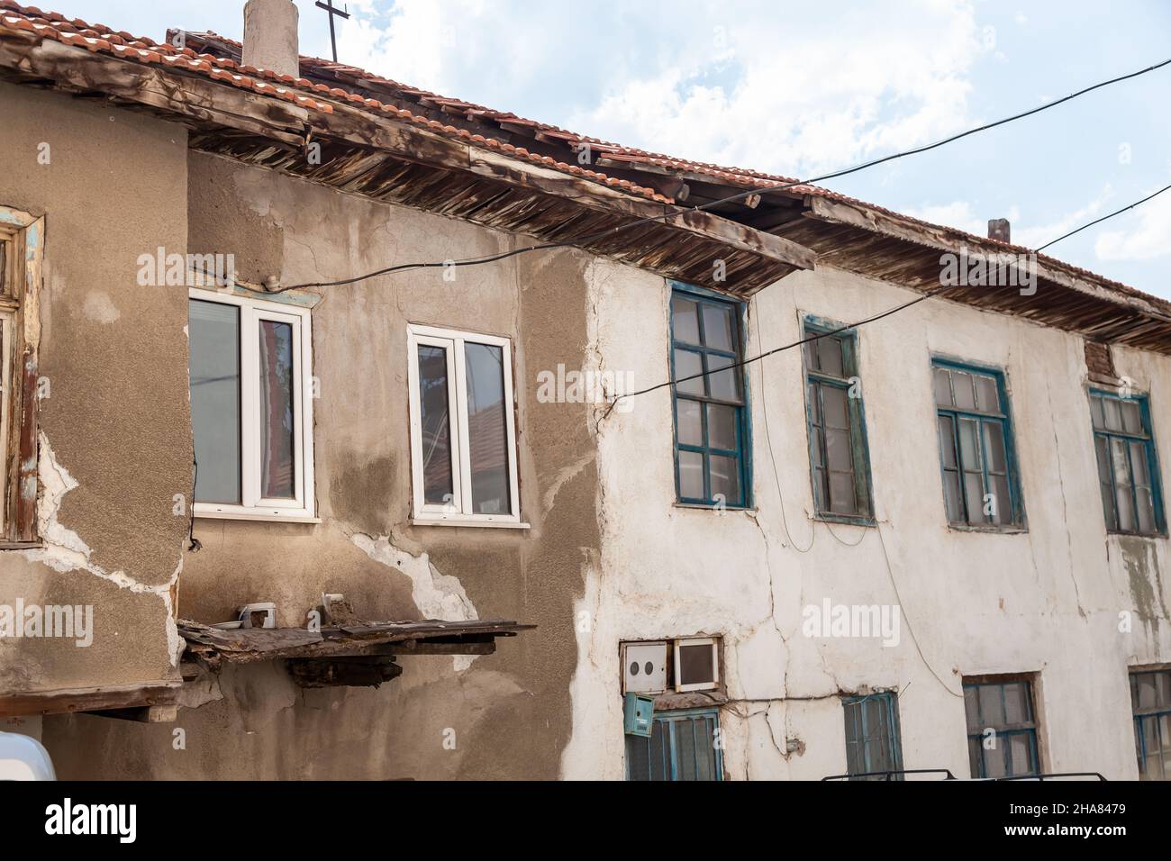 Old crumbling buildings and crumbling hillsides in the slums of Ankara ...