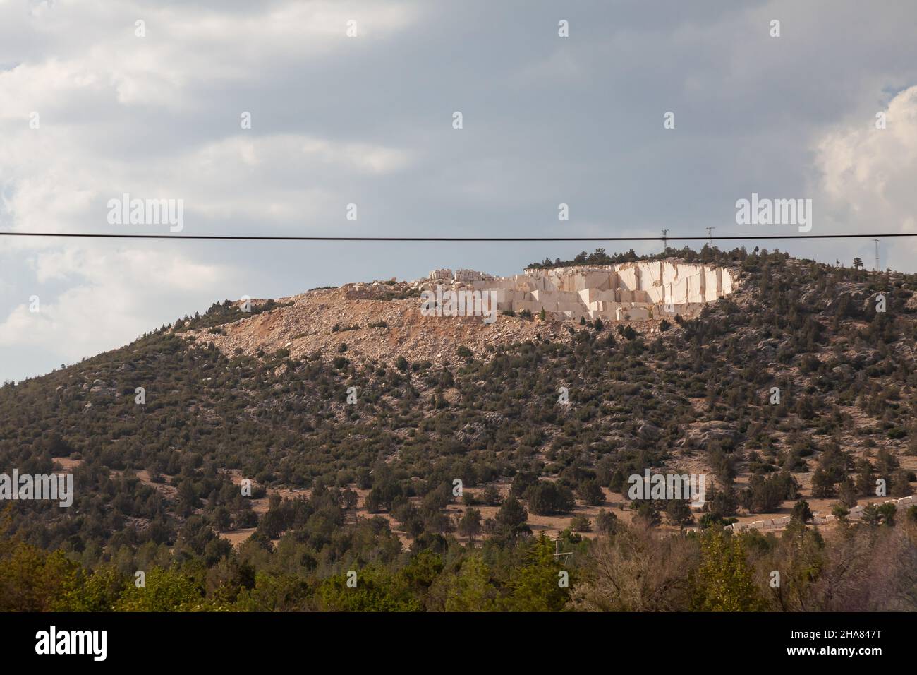 High stone mountain and marble quarries in Turkey. Open marble mining ...