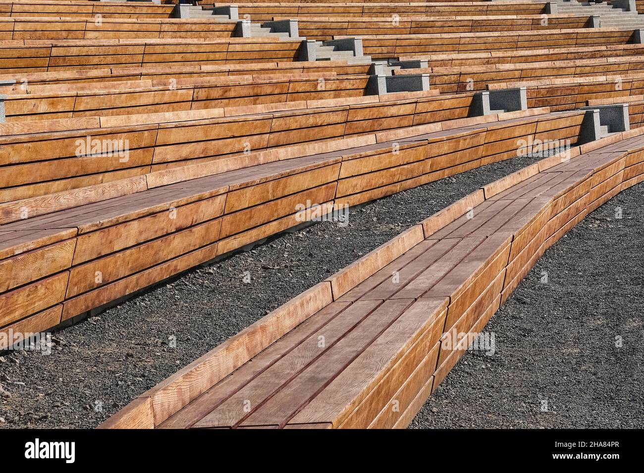 Empty wooden benches in open air outdoor city public event space.Modern ...