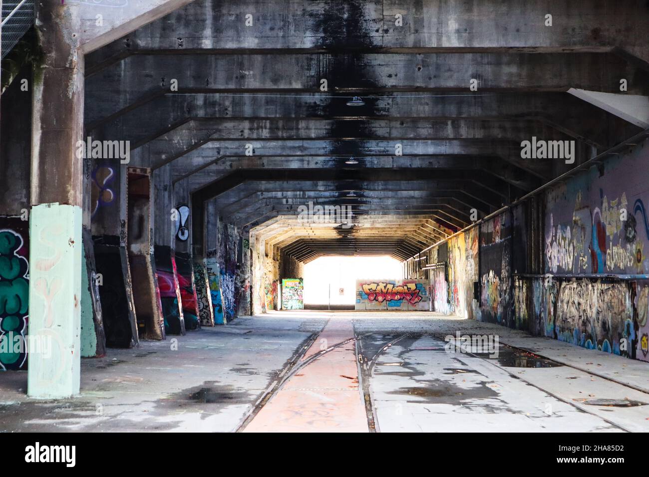 Abandoned spooky underground tunnel with graffitis Stock Photo - Alamy