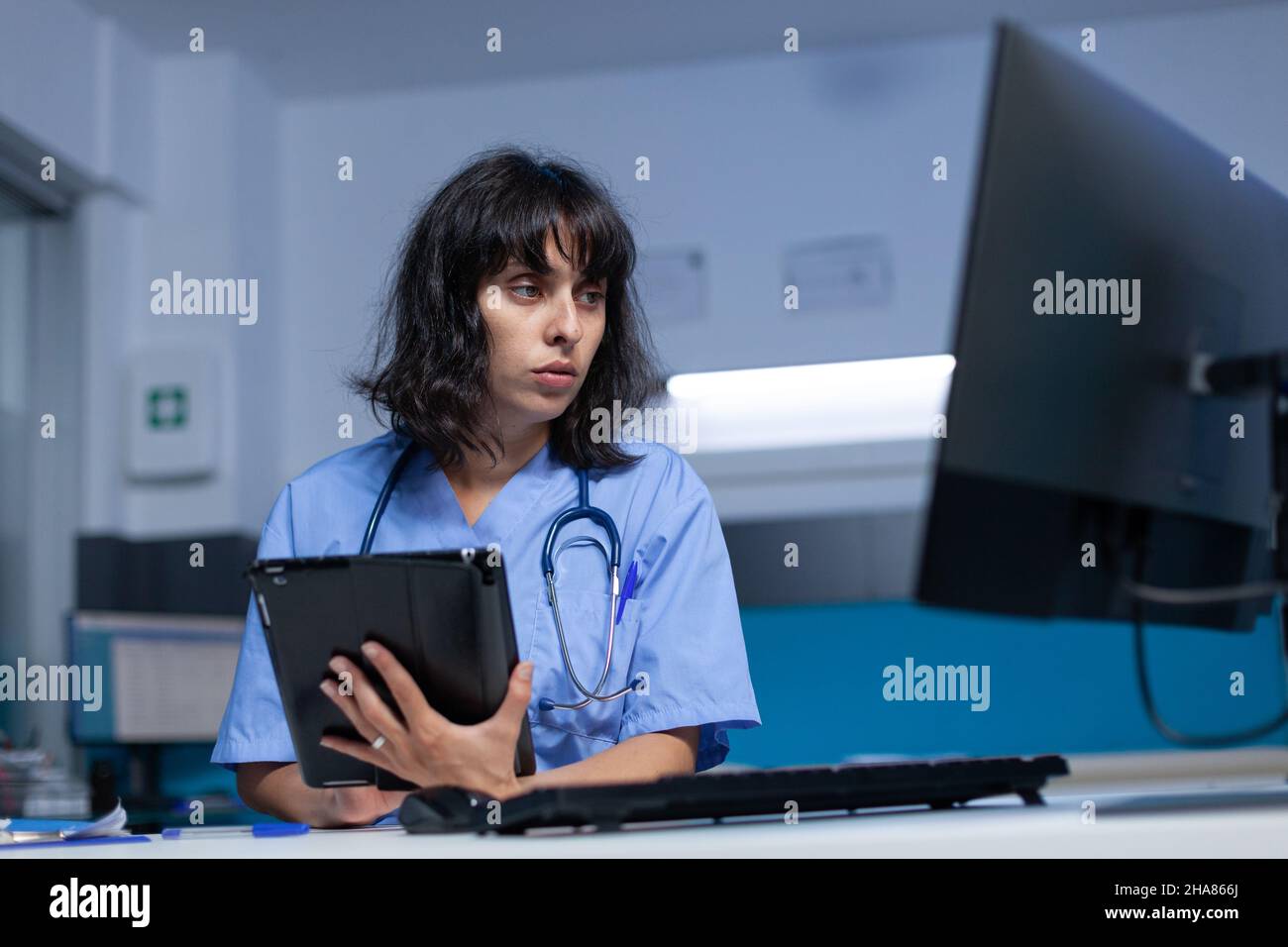 Medical assistant using tablet with touch screen for healthcare system ...