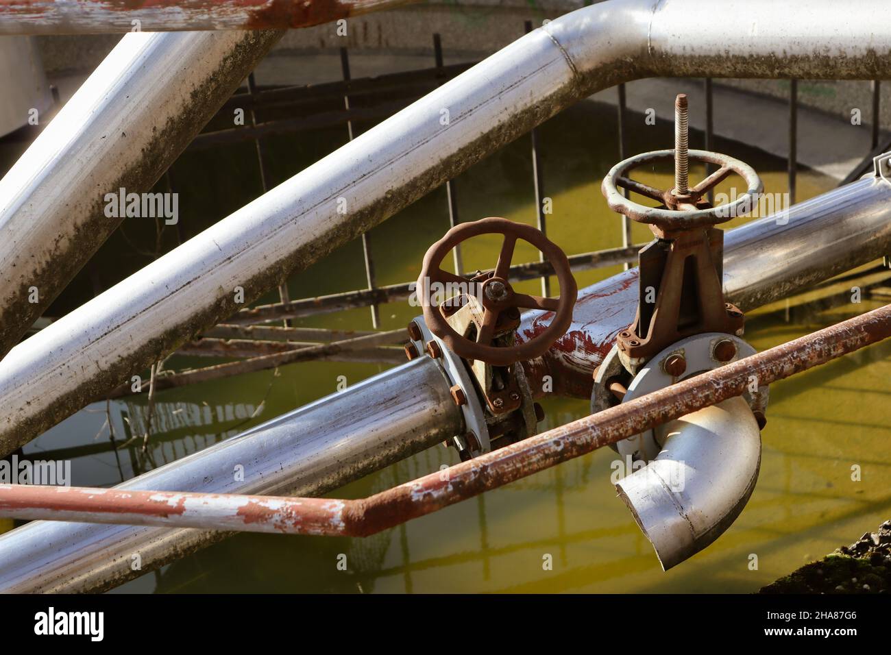 old rusty cables and pipes with wheels Stock Photo - Alamy