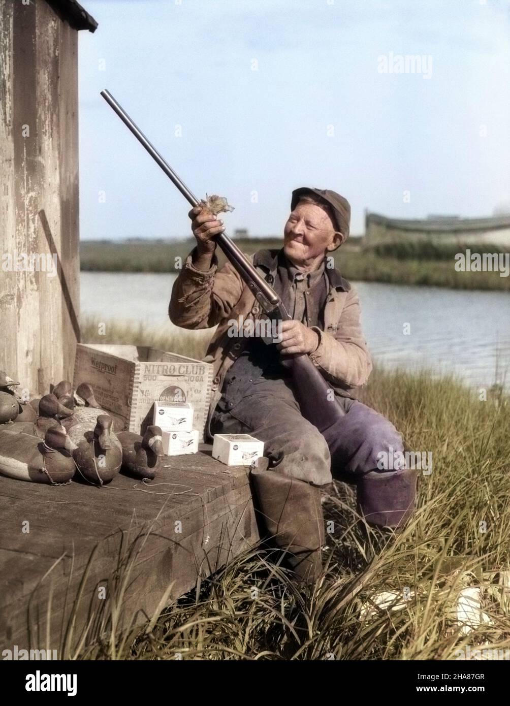 1920s SMILING SENIOR MAN CLEANING PARKER SHOTGUN SURROUNDED BY DUCK ...