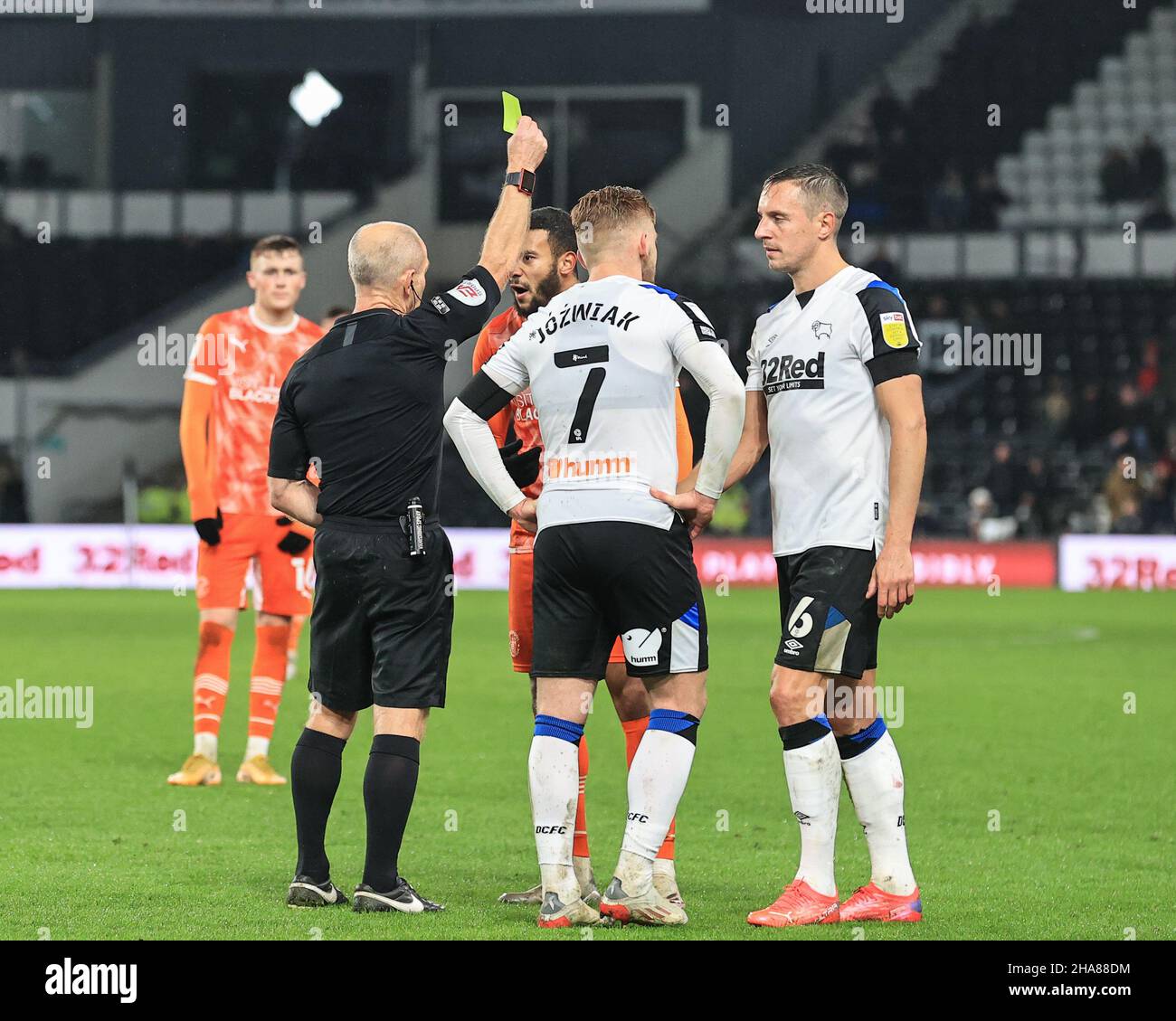 Referee Andy Woolmer gives a yellow card to Keshi Anderson #10 of ...