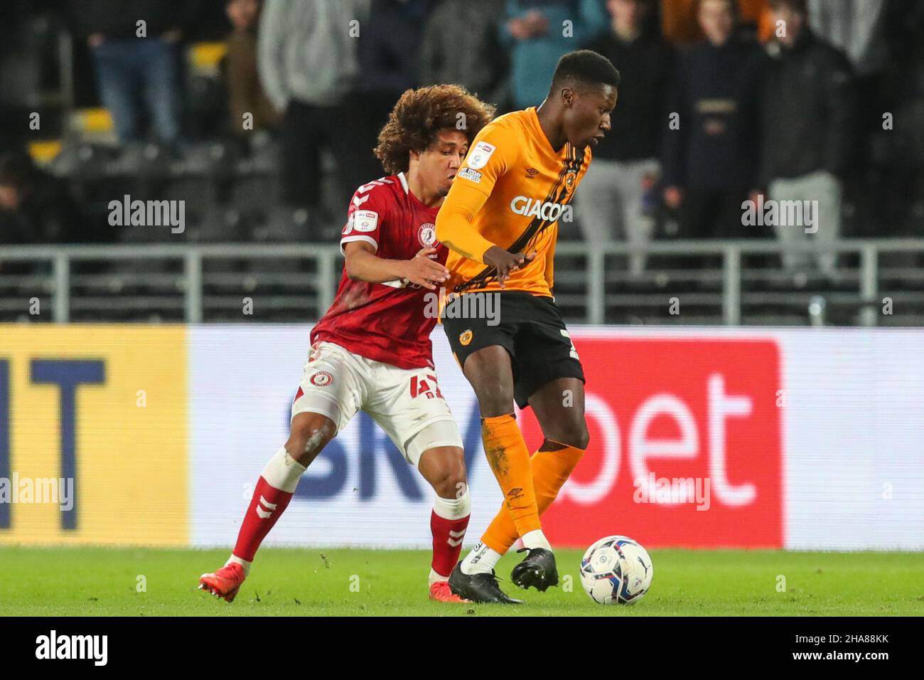 Di'Shon Bernard #24 of Hull City shields the ball from Han-Noah ...