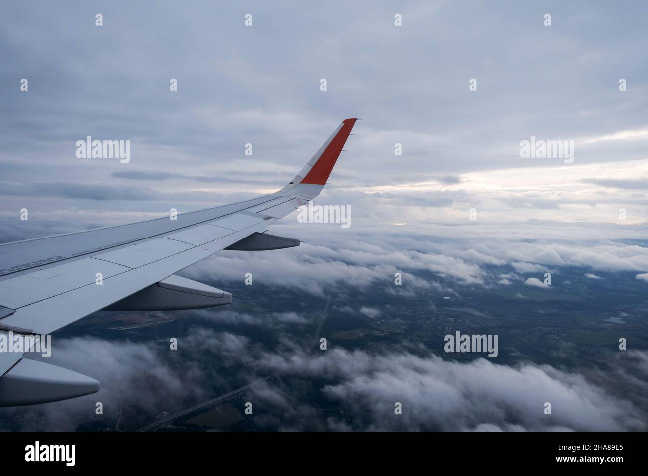 Classic image through aircraft window onto wing. Flight view over ...