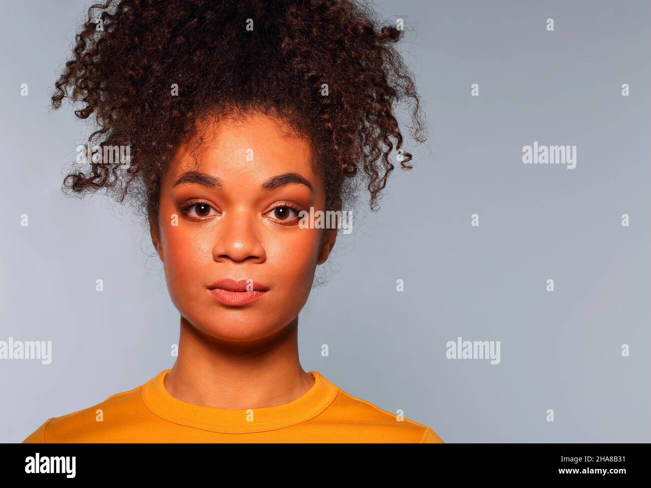 Portrait of ethnic young woman of african race with focused calm facial ...
