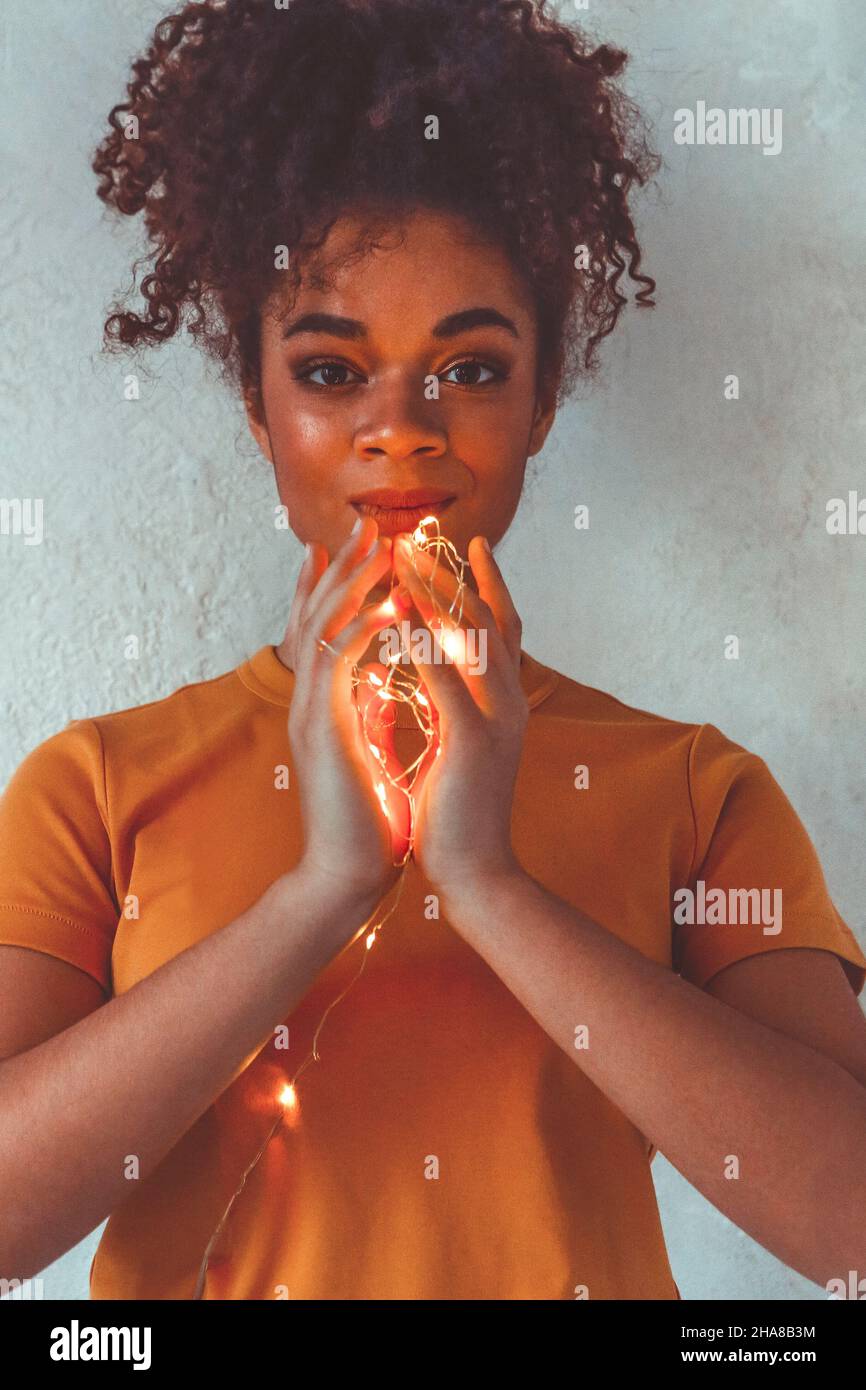 Girl holding led bulb hi-res stock photography and images - Alamy