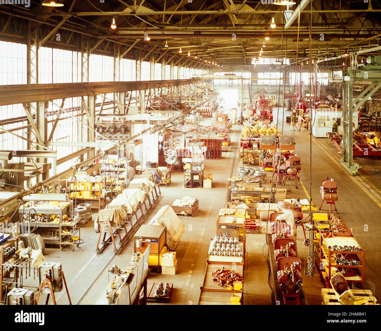 1960s LOOKING DOWN ACROSS INTERIOR OF INDUSTRIAL FACTORY FLOOR IN A ...