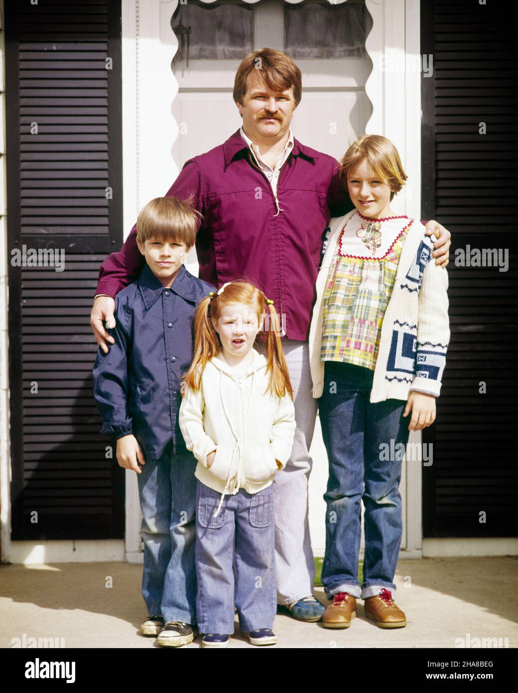 1970s FAMILY PORTRAIT OF FATHER STANDING WITH THREE CHILDREN BOY TWO ...