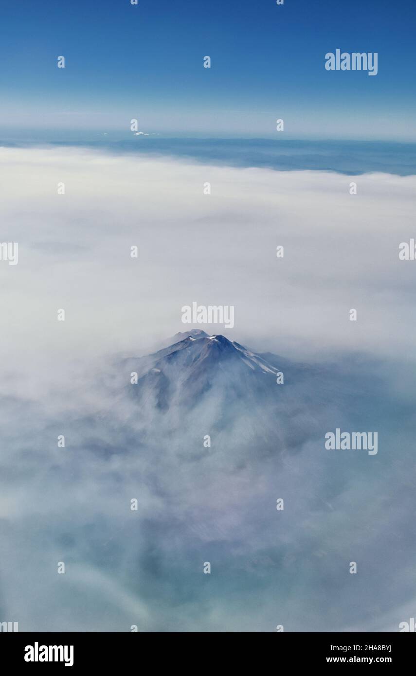 Mount Shasta aerial view from airplane, Northern California Cascade ...
