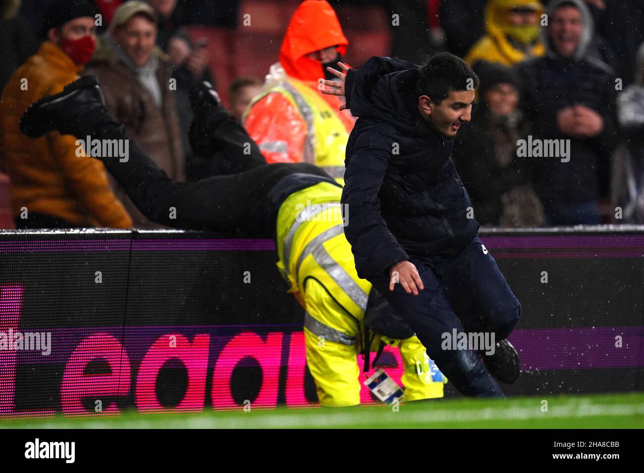 A pitch invader during the Premier League match at the Emirates Stadium ...