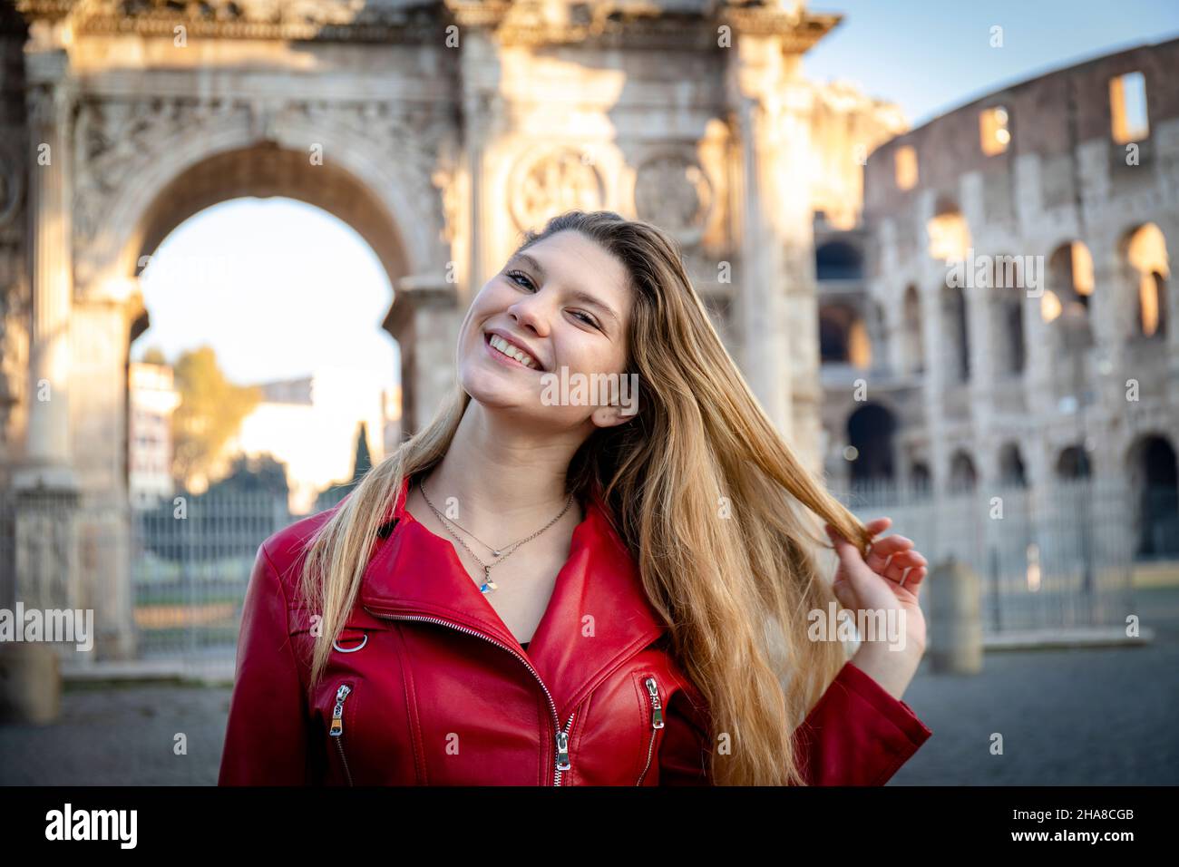 Young woman traveling to Rome. Beautiful blonde woman takes a picture ...