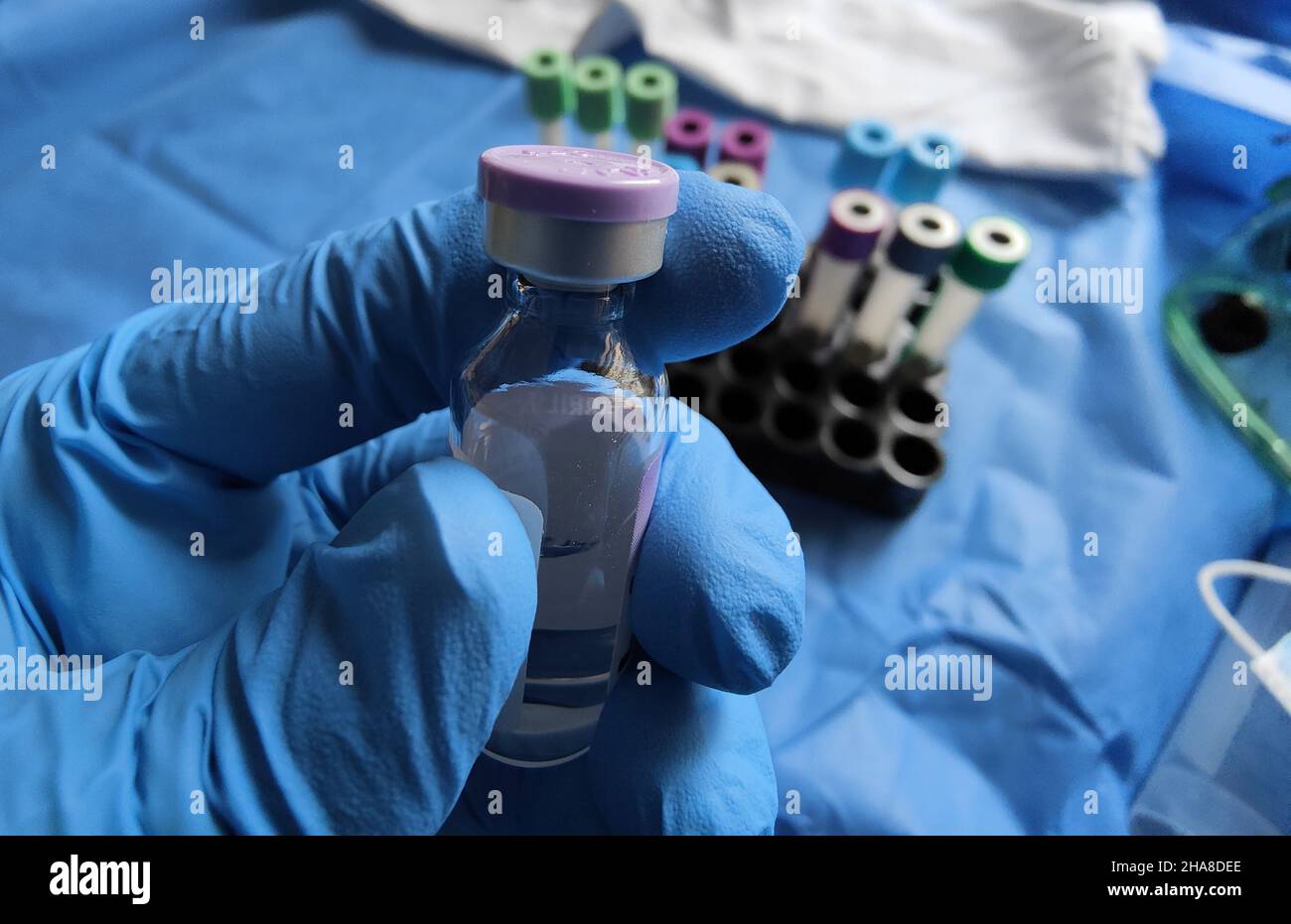 Nurse showing a vial of vaccines Stock Photo - Alamy