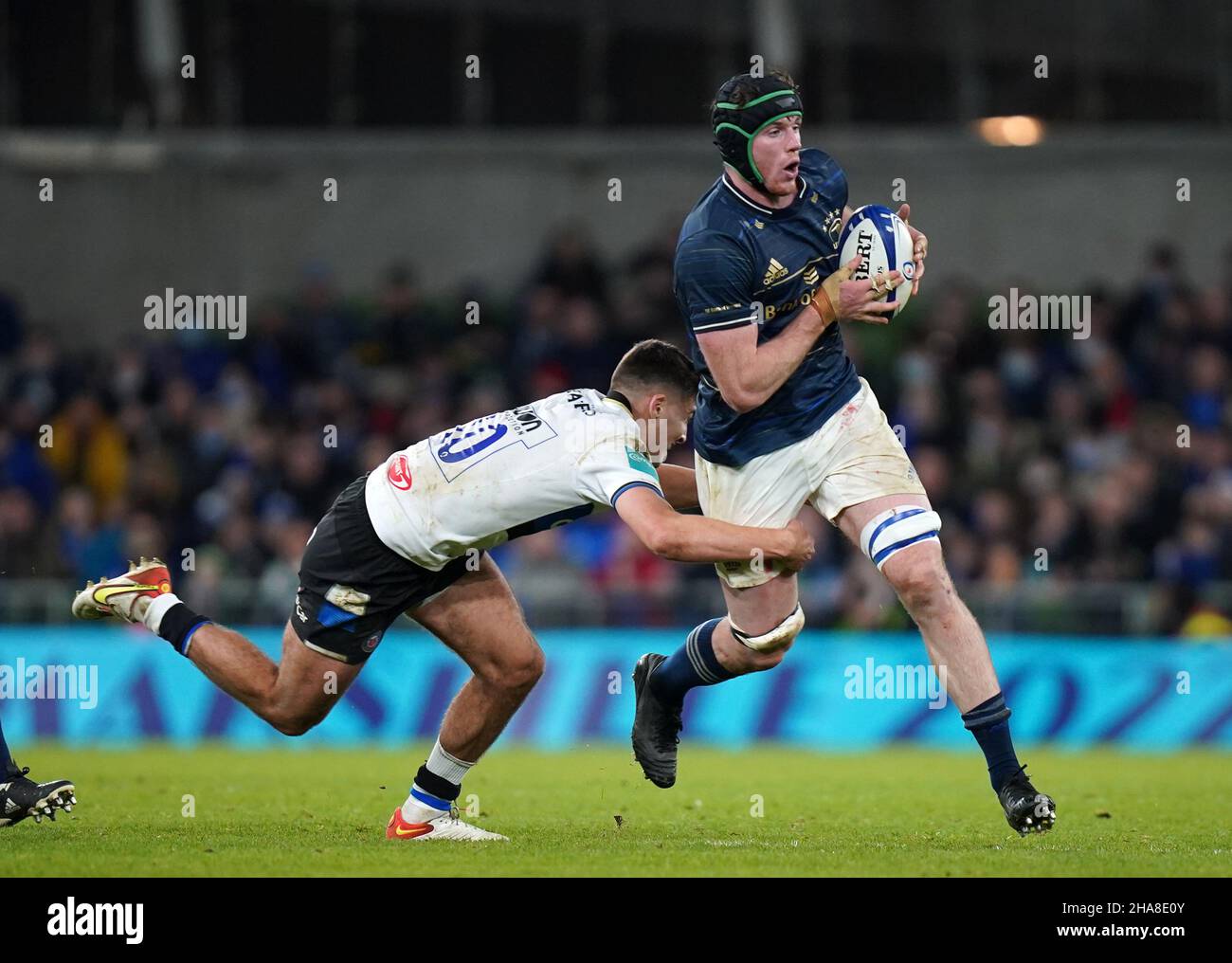 Leinster Rugby's Ryan Baird and Bath Rugby's Jacques Du Toit in action ...
