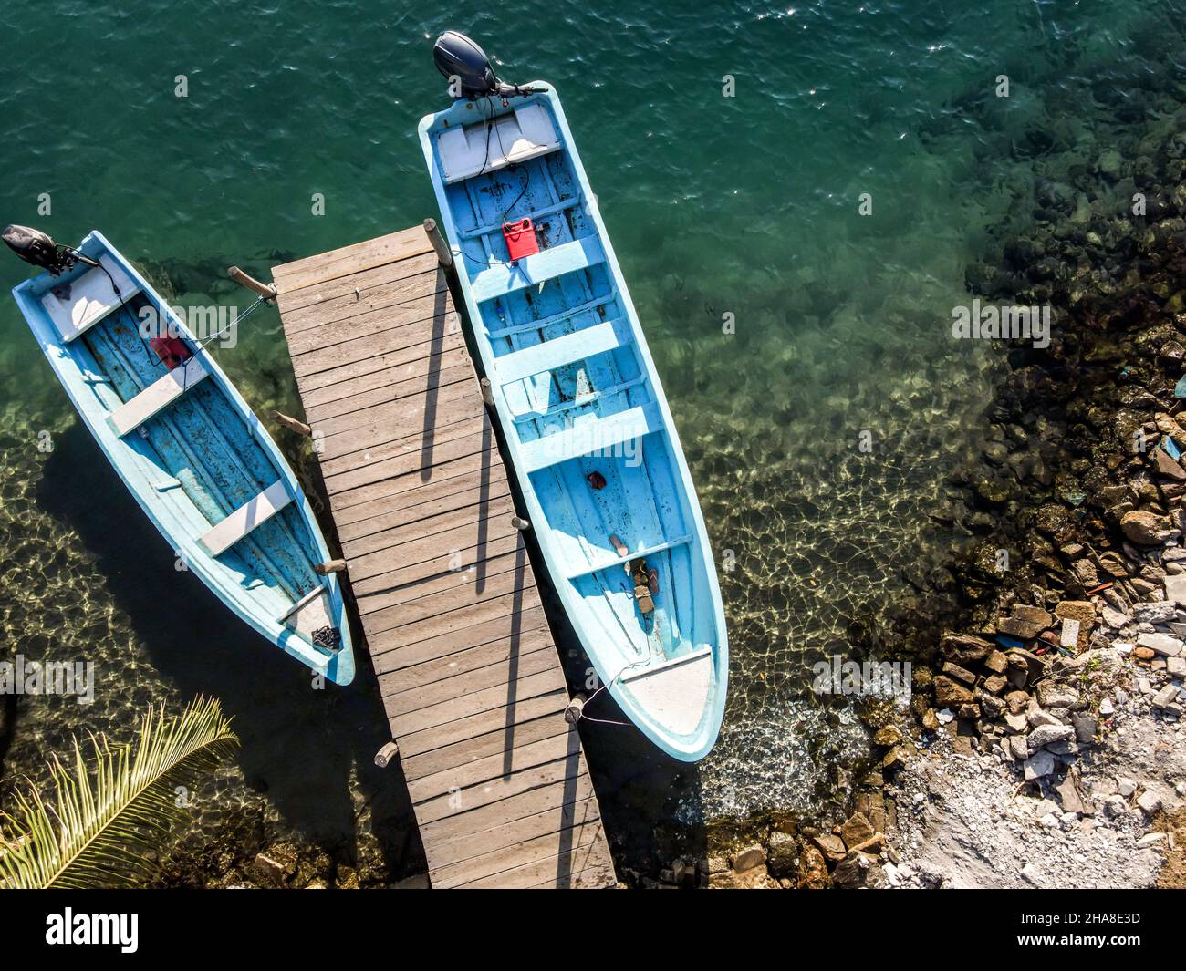 aerial view of two blue boats in mooring Stock Photo - Alamy