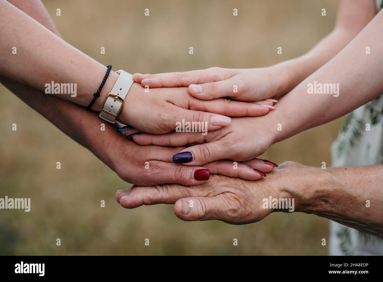 Closeup shot of women's hands from different generations together Stock ...
