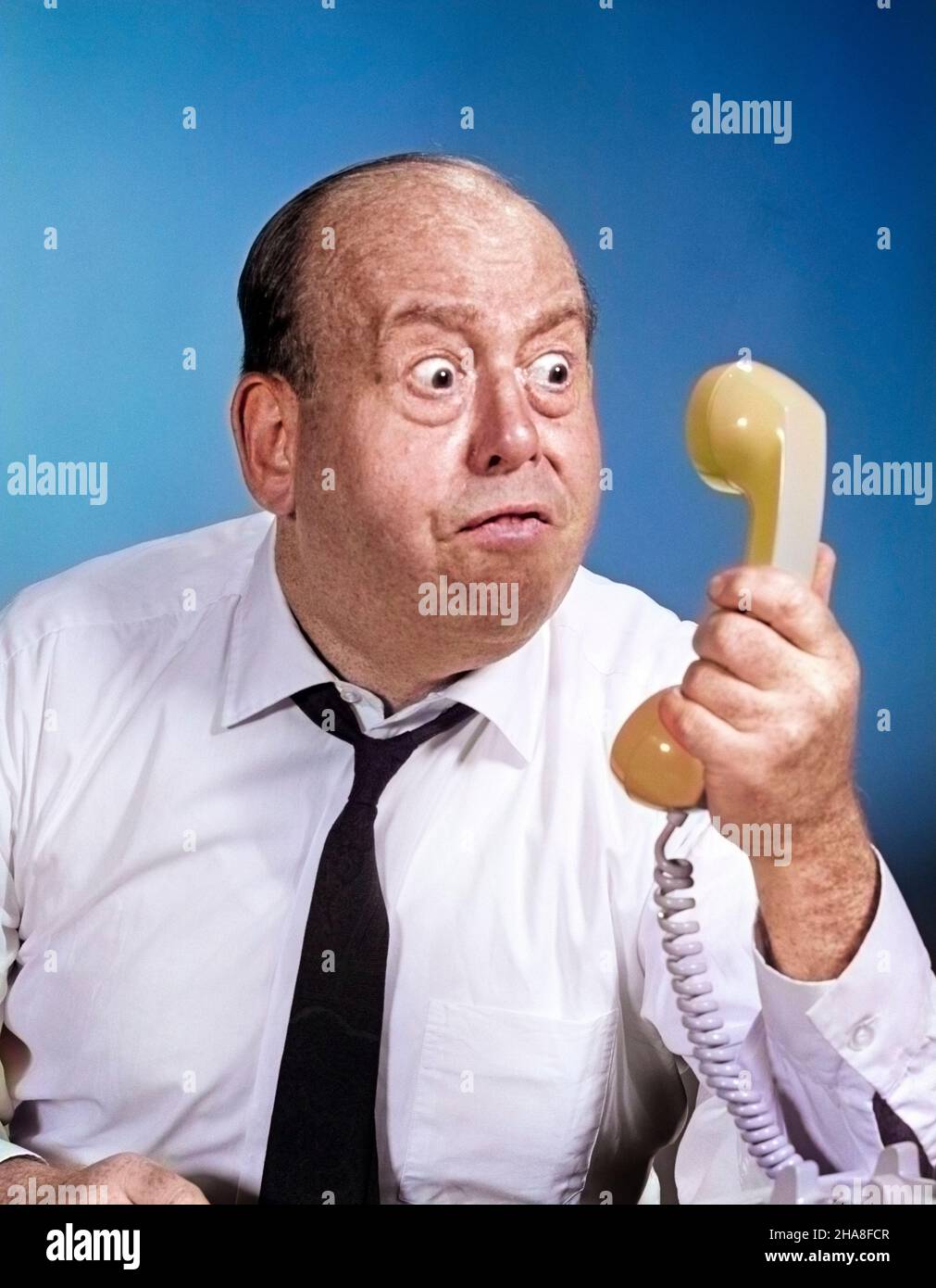 1960s 1970s ANGRY BALDING MAN LOOKING BUG-EYED INTO TELEPHONE RECEIVER ...