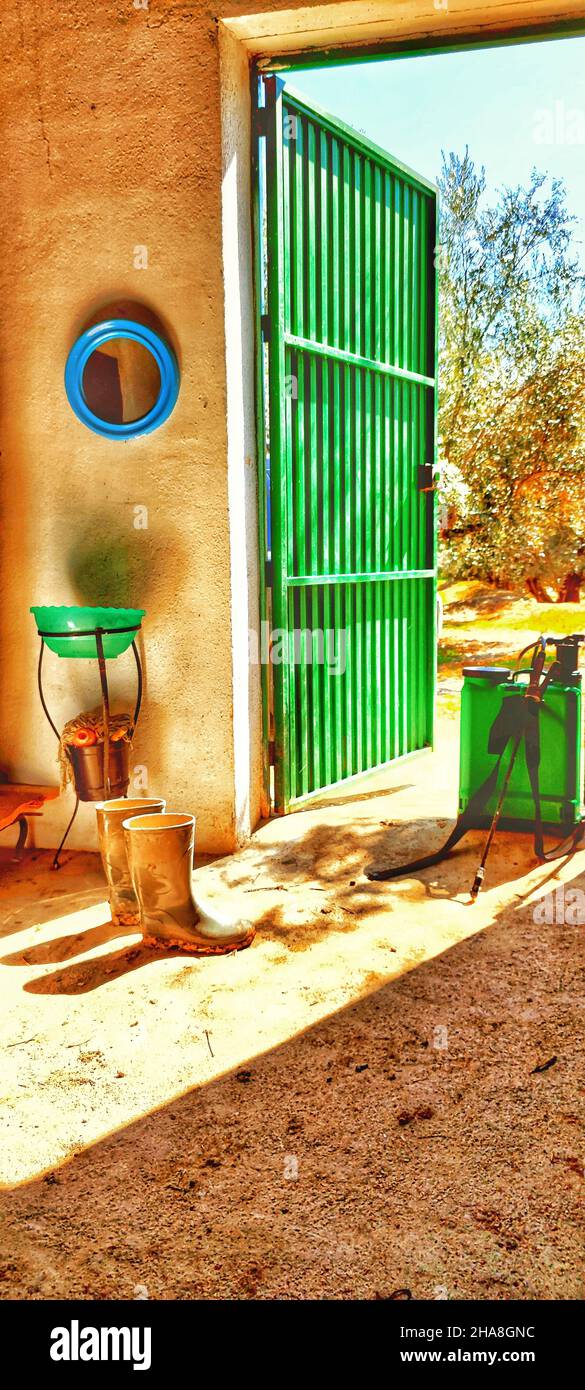 Rural warehouse with agricultural implements with metal door Stock ...