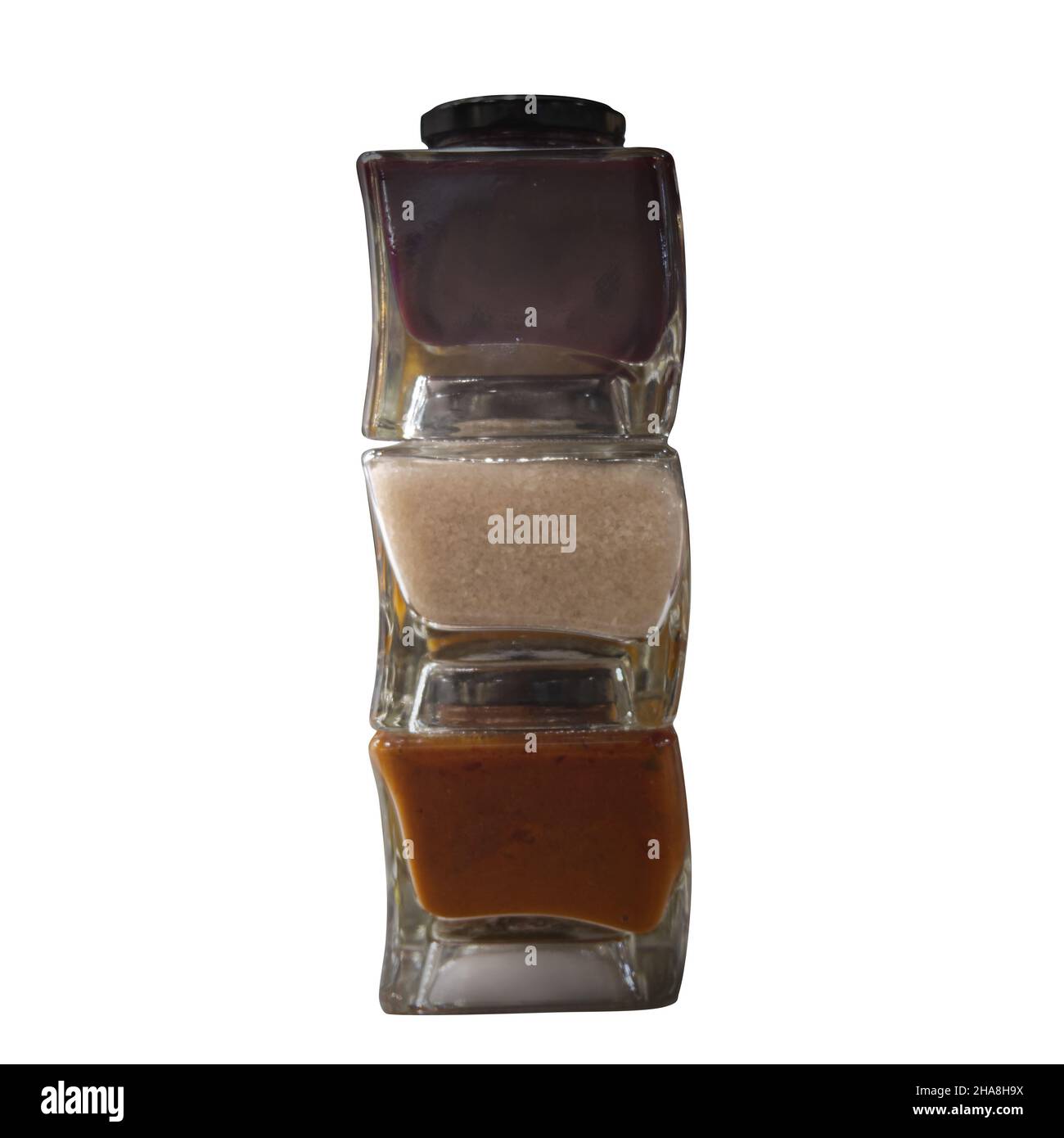 vertical composition of spice glass containers on a white background ...