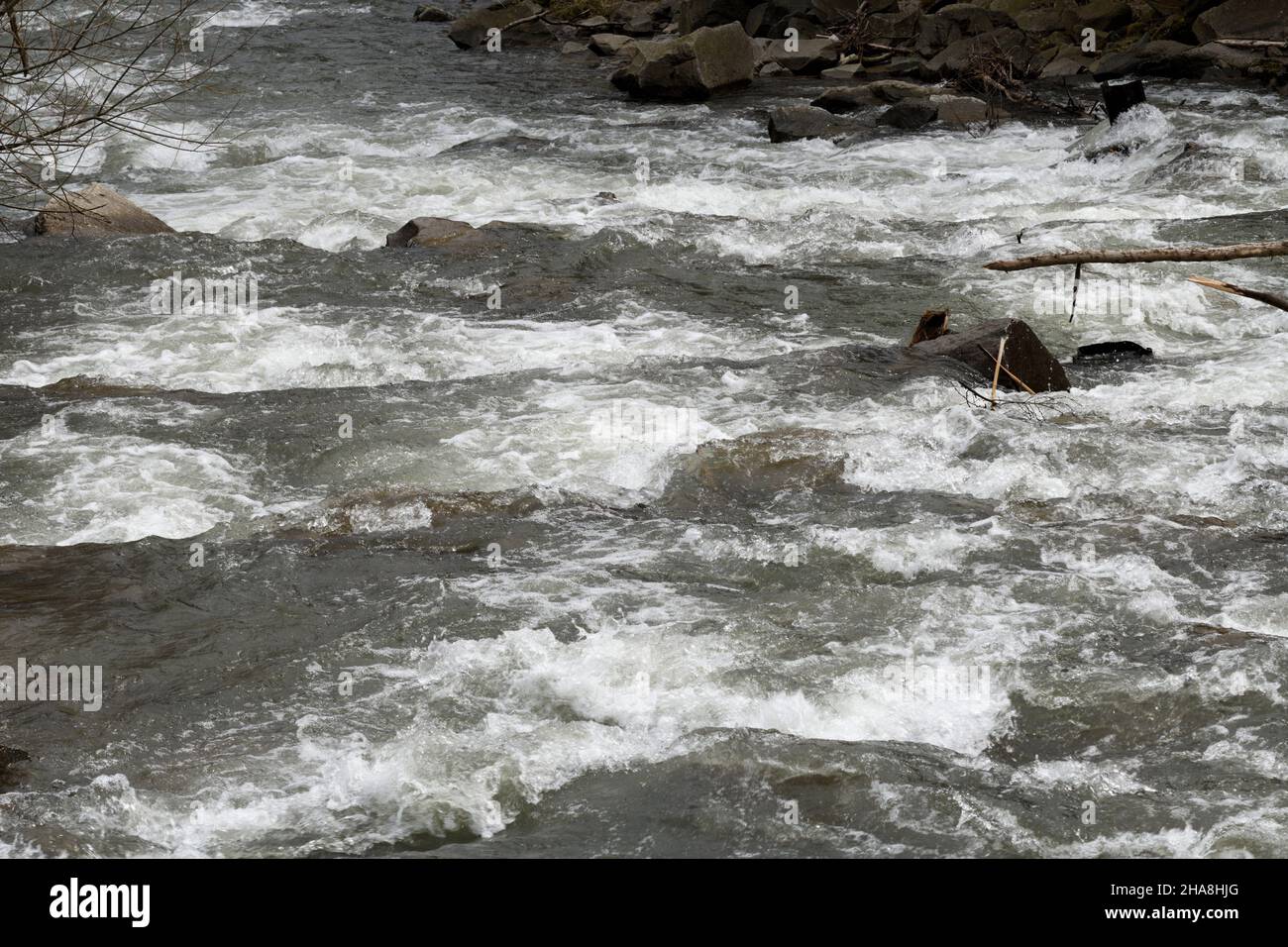 Dangerous rocks and waves of a wild river Stock Photo - Alamy