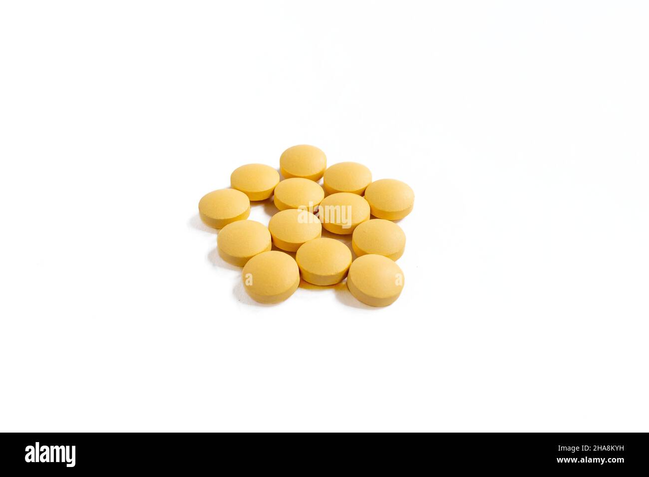 Yellow pills, group of painkiller pills isolated on white background ...