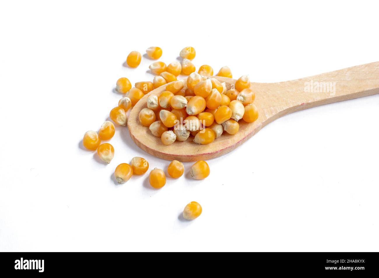 Top view corn kernels, wooden spoon with corn kernels isolated on white ...