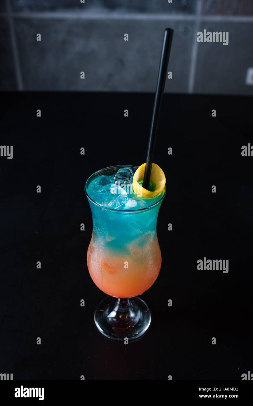 Delicious rainbow citrus cocktail on a dark surface in a bar Stock ...