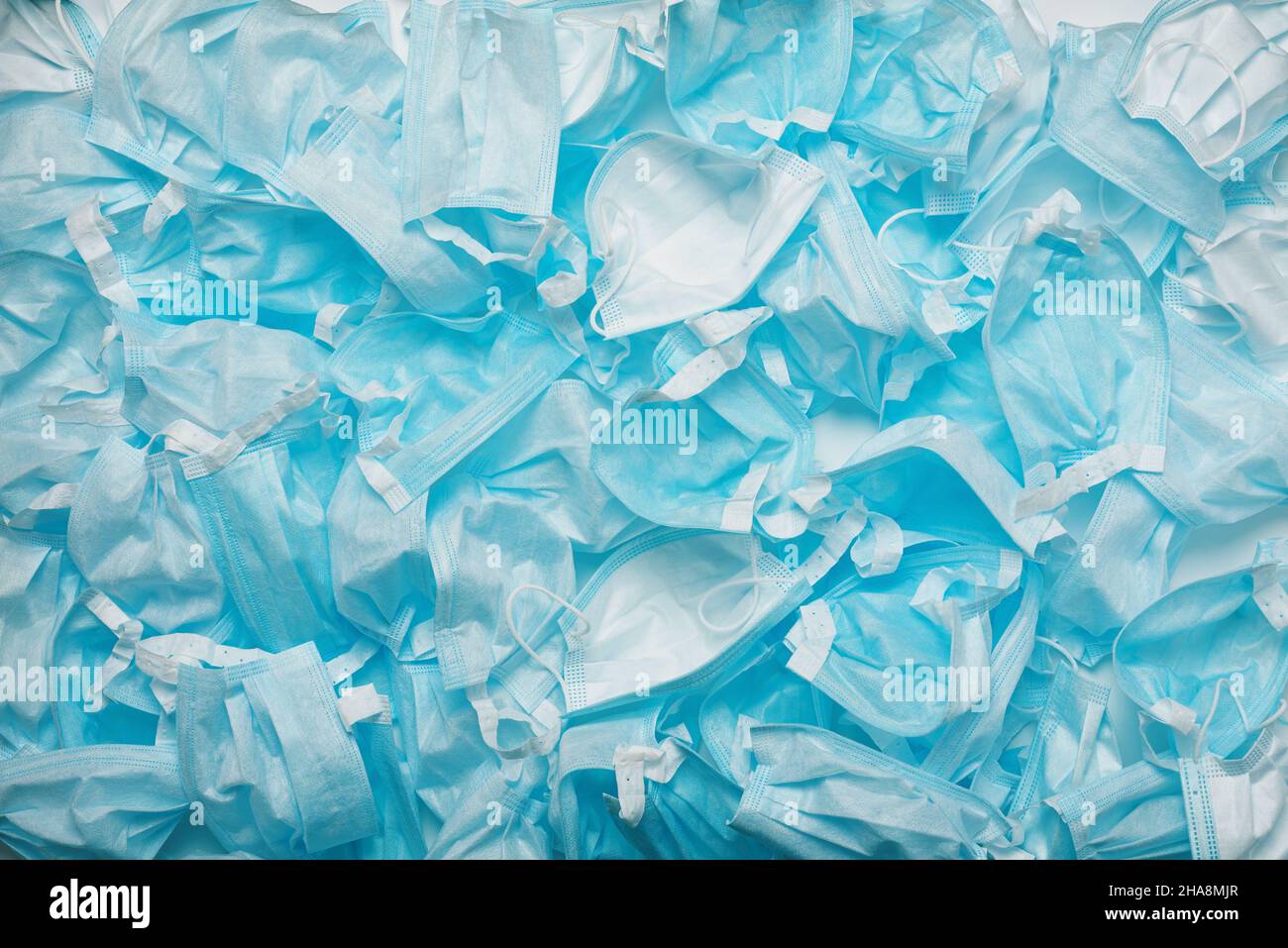 The background mask is used. Disposal of the coronavirus. Garbage mask ...