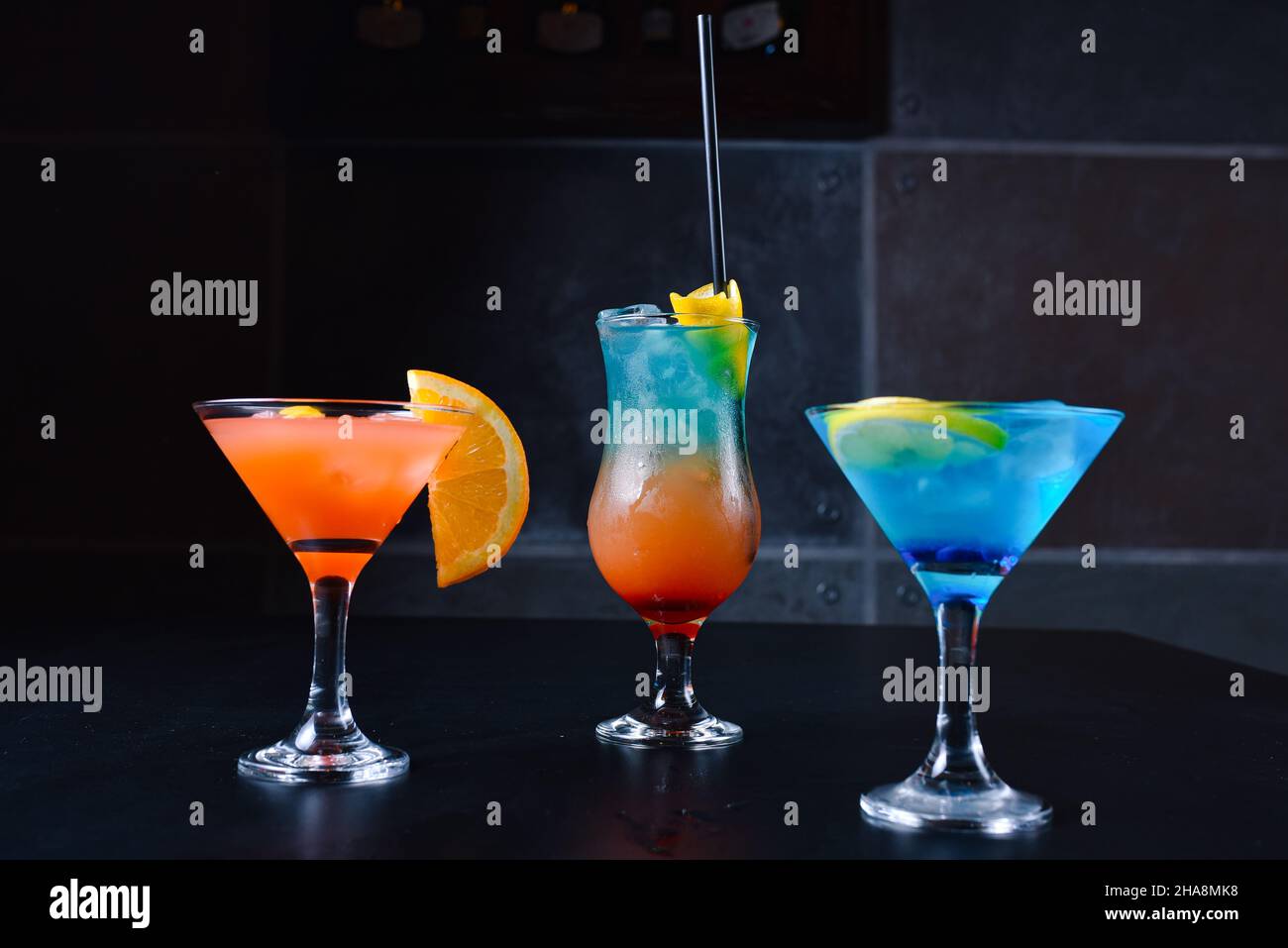 Delicious and refreshing cocktails in blue and orange color gradient at ...