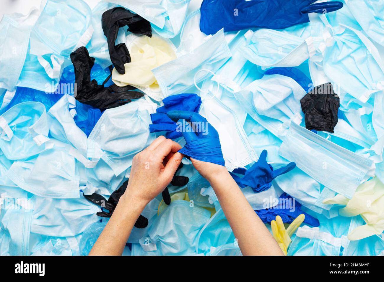 Waste of used personal protective equipment PPE, gloves, disposable ...